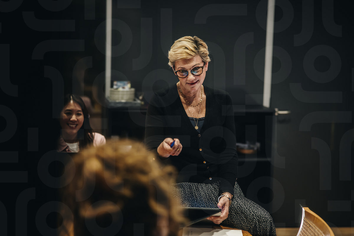 Female CEO giving instructions in meeting. – Jacob Lund Photography ...
