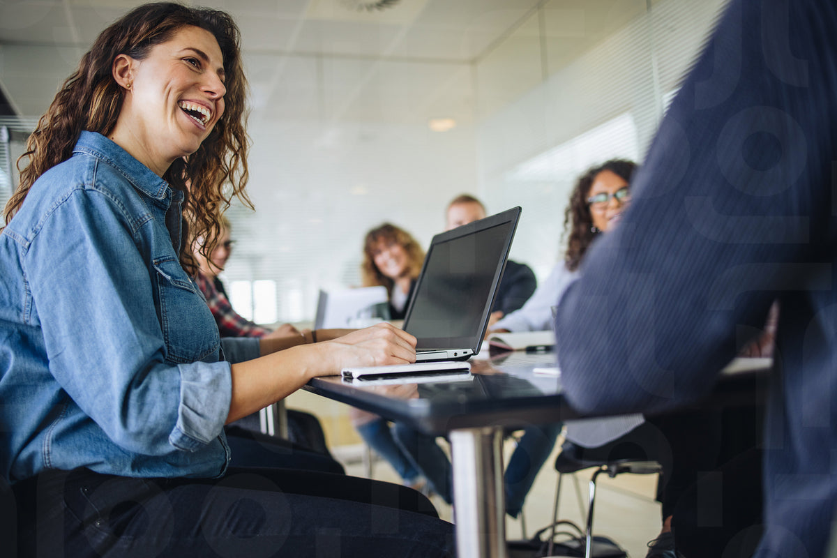 Female professional smiling during meeting – Jacob Lund Photography ...