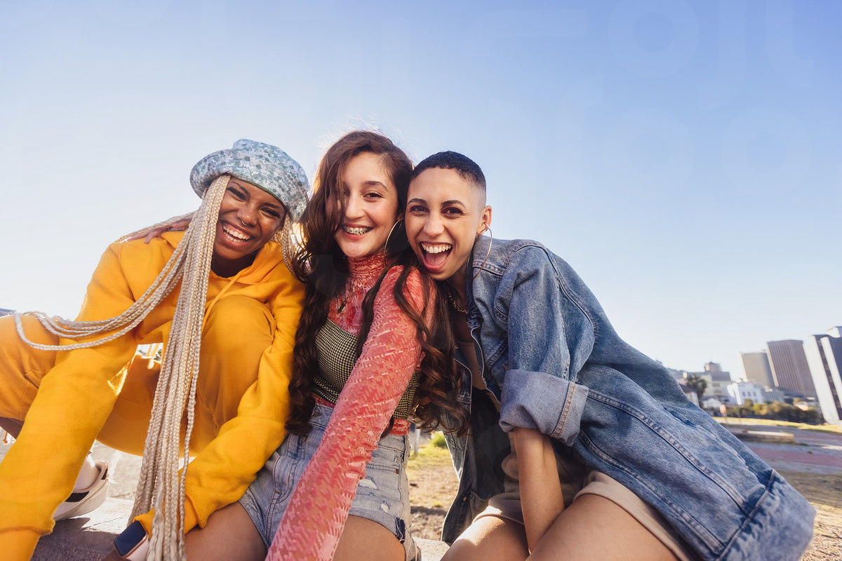 Gen z friends having a good time together outdoors – Jacob Lund ...