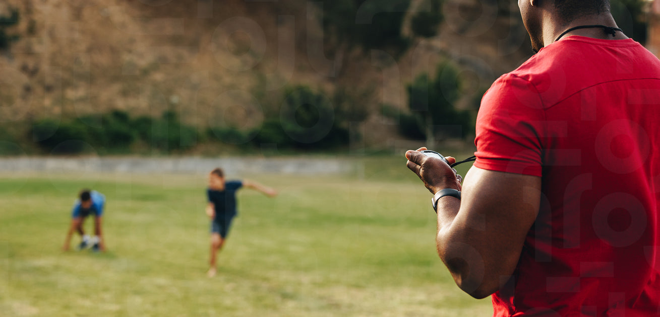 Man coaching school children in a sports ground – Jacob Lund ...