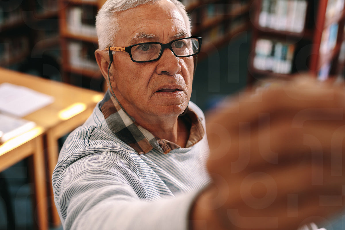 Close up of a professor teaching in classroom writing on board – Jacob ...