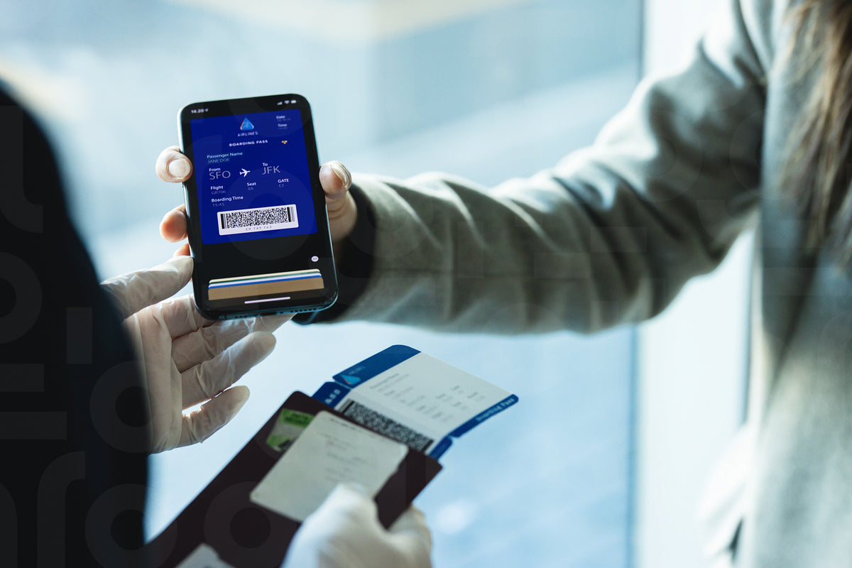 Passenger showing digital boarding pass to airline attendant – Jacob ...