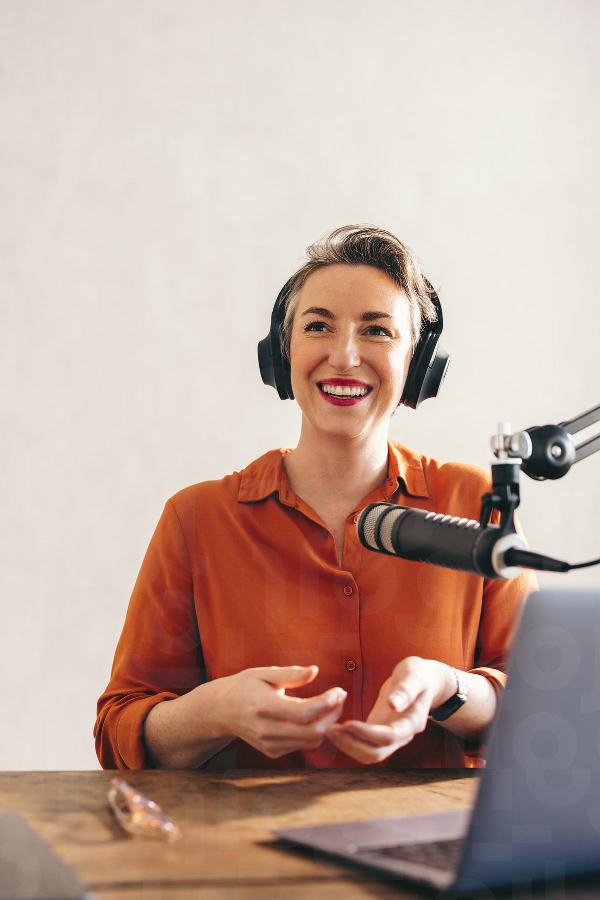 Happy female podcaster smiling in a home studio – Jacob Lund ...